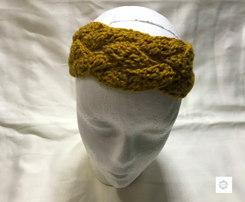 Cache oreille au crochet la tresse à quatre brins - Serena Crochet